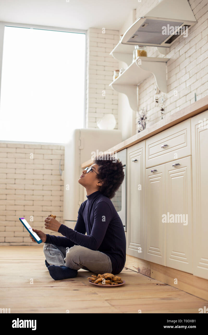 Teenager boy eating cookies hi-res stock photography and images - Alamy