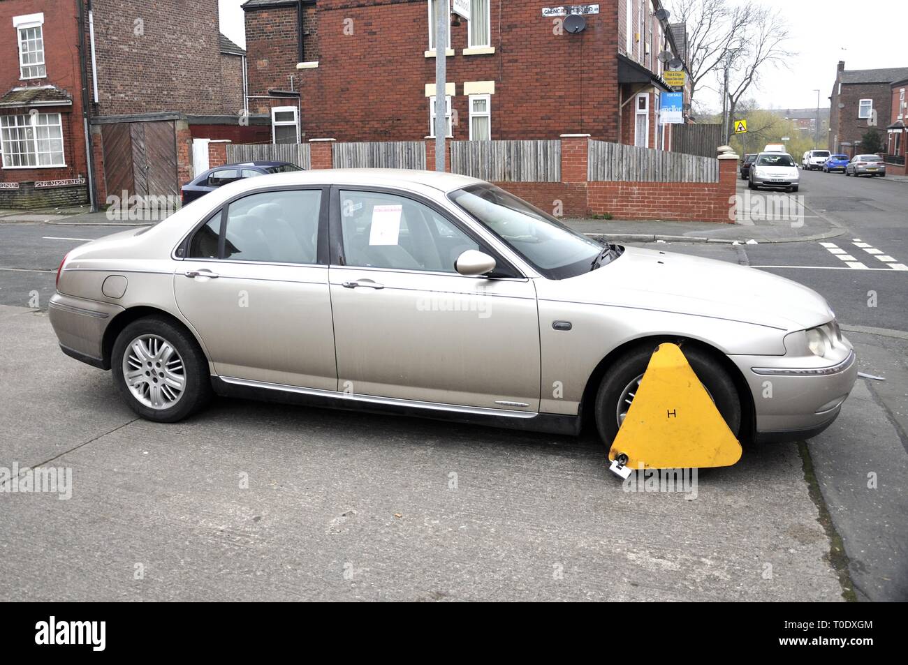 Saloon car clamped Stock Photo - Alamy