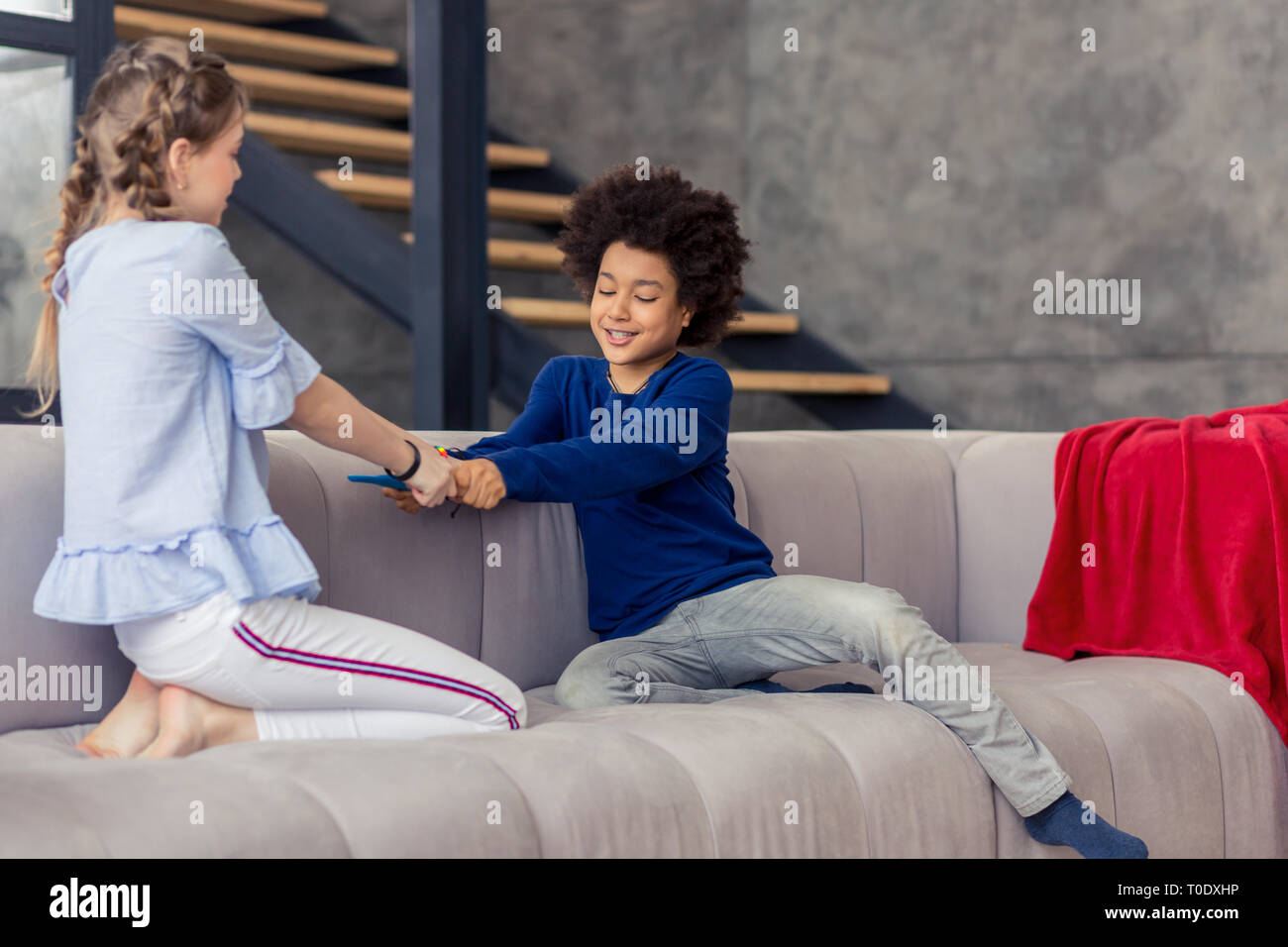 Child taking away tablet hi-res stock photography and images - Alamy