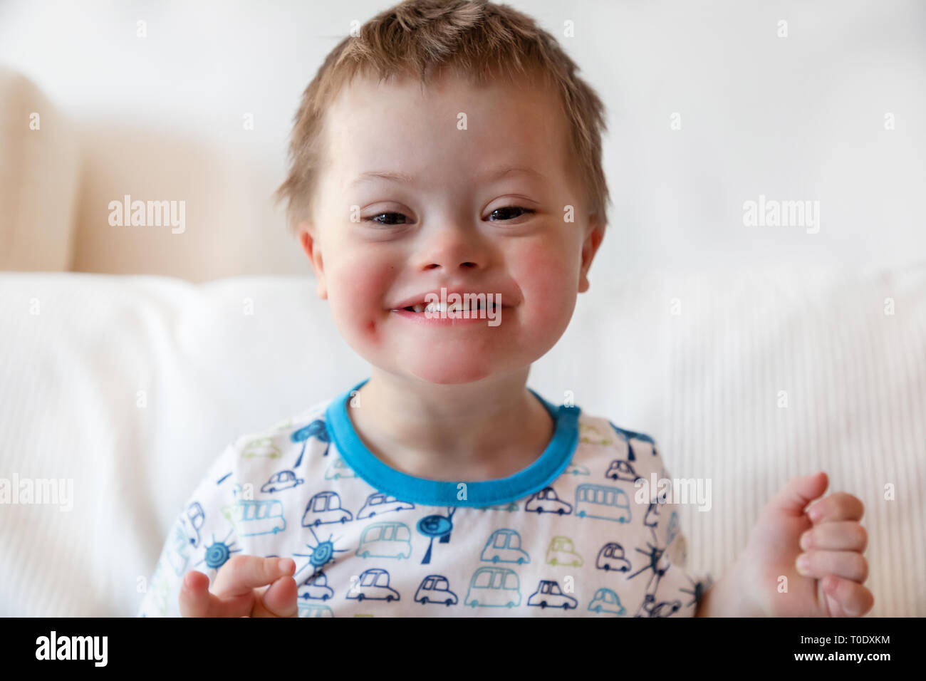 Portrait of cute small boy with Down syndrome Stock Photo - Alamy