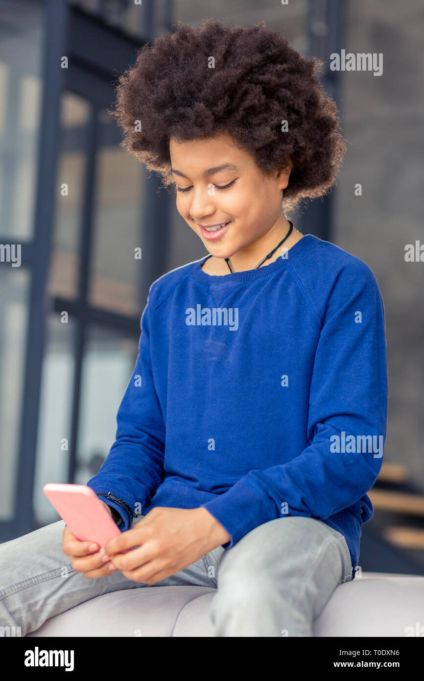 Teen boy reading at home hi-res stock photography and images - Alamy