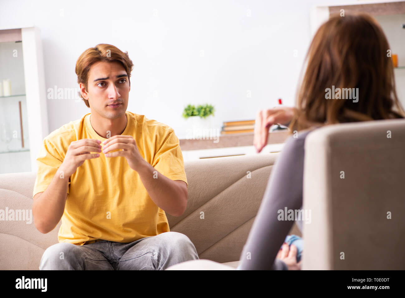 Woman and man learning sign language Stock Photo - Alamy