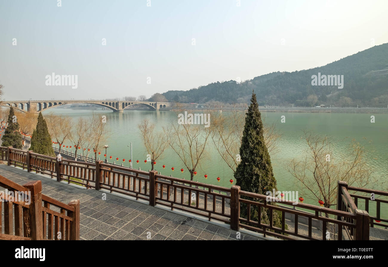 The walk way along and the bridge with the Chinese style at the Longmen ...