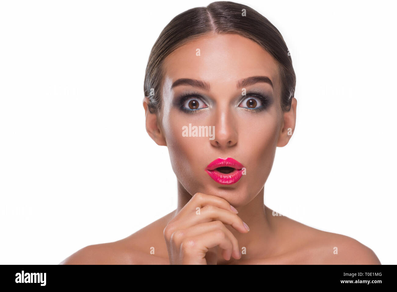 Beautiful brunette with wow face Stock Photo - Alamy