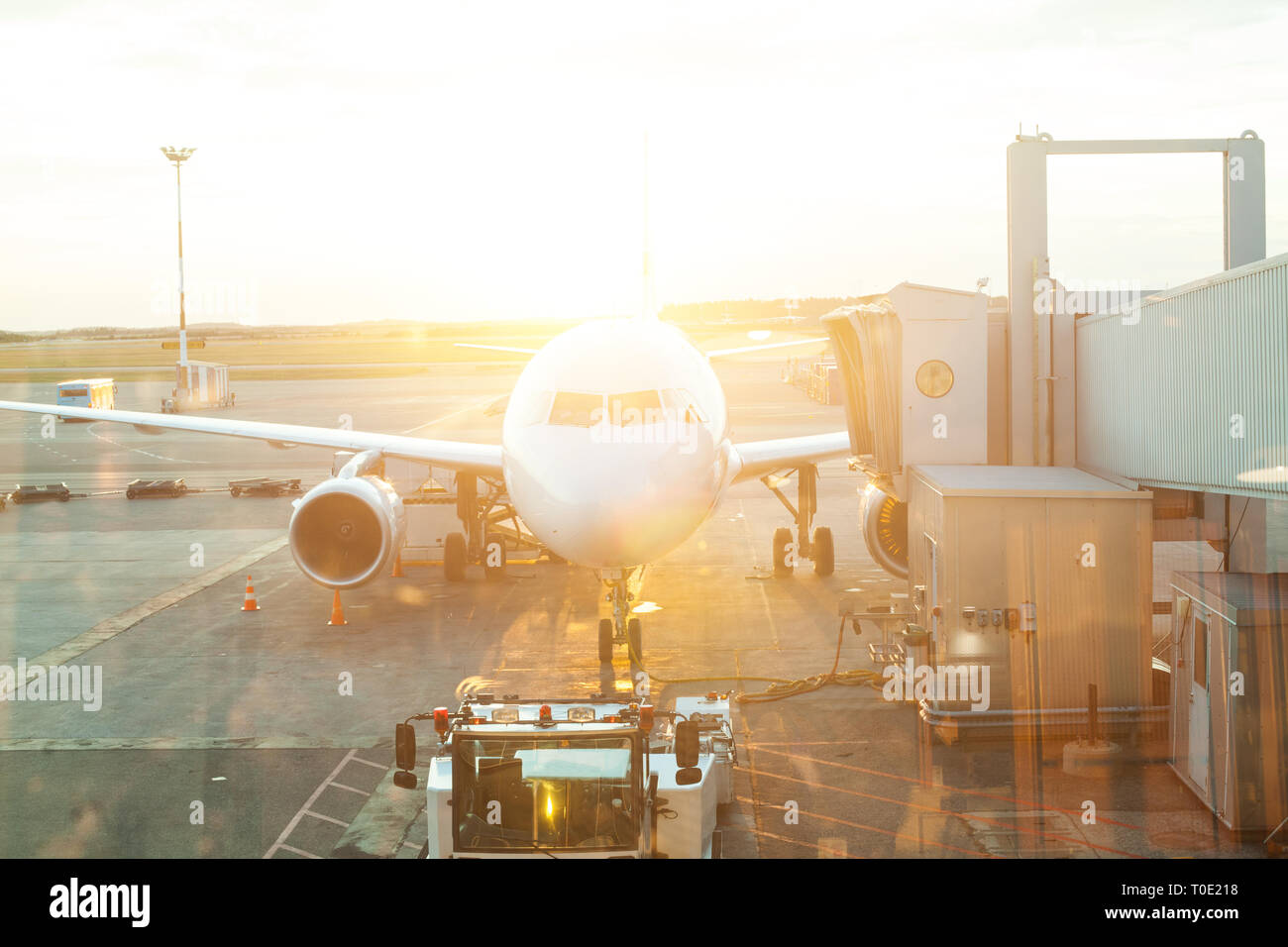 Airplane through airport window view at the terminal gate ready for ...