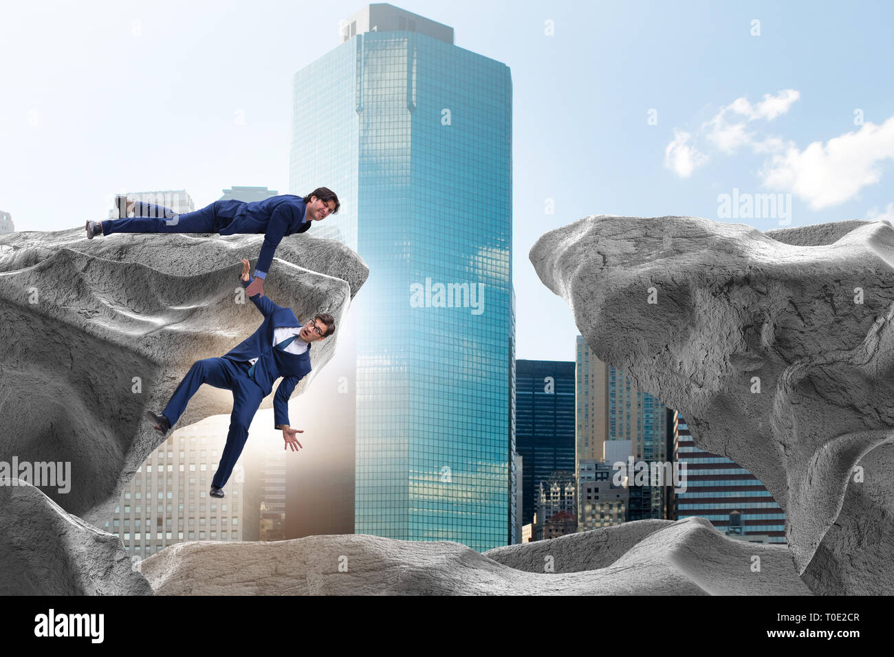 Businessman offering helping hand to falling colleague Stock Photo - Alamy