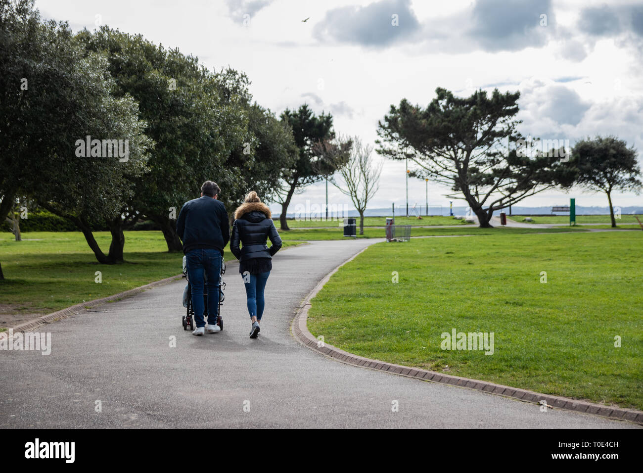 Dad pushing a pram in a park hi-res stock photography and images - Alamy
