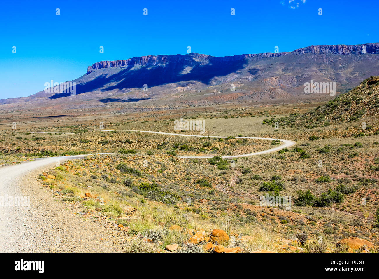 Dirt road with blue sky, Karoo National Park in the summer, Western ...