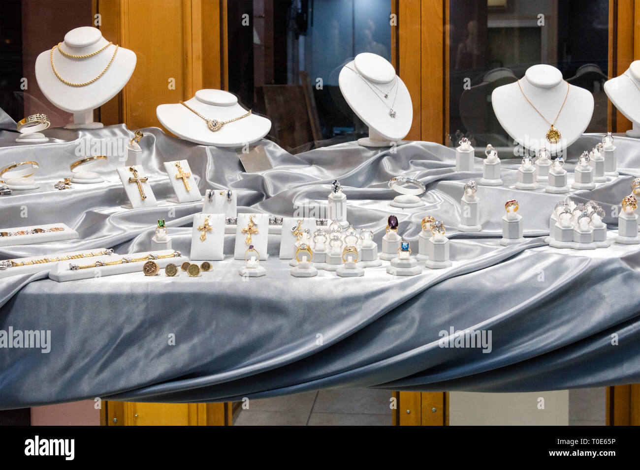 Jewelry diamond rings and necklaces show in luxury retail store window ...