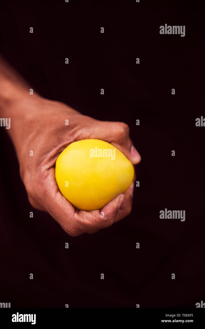 Hand Squeezing Stress Ball Stock Photo - Alamy