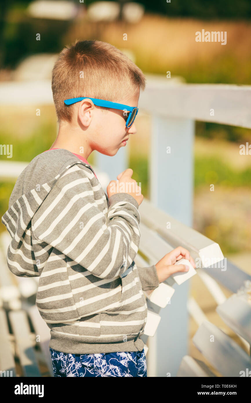Leisure and free time concept. Portrait of little boy spending time ...