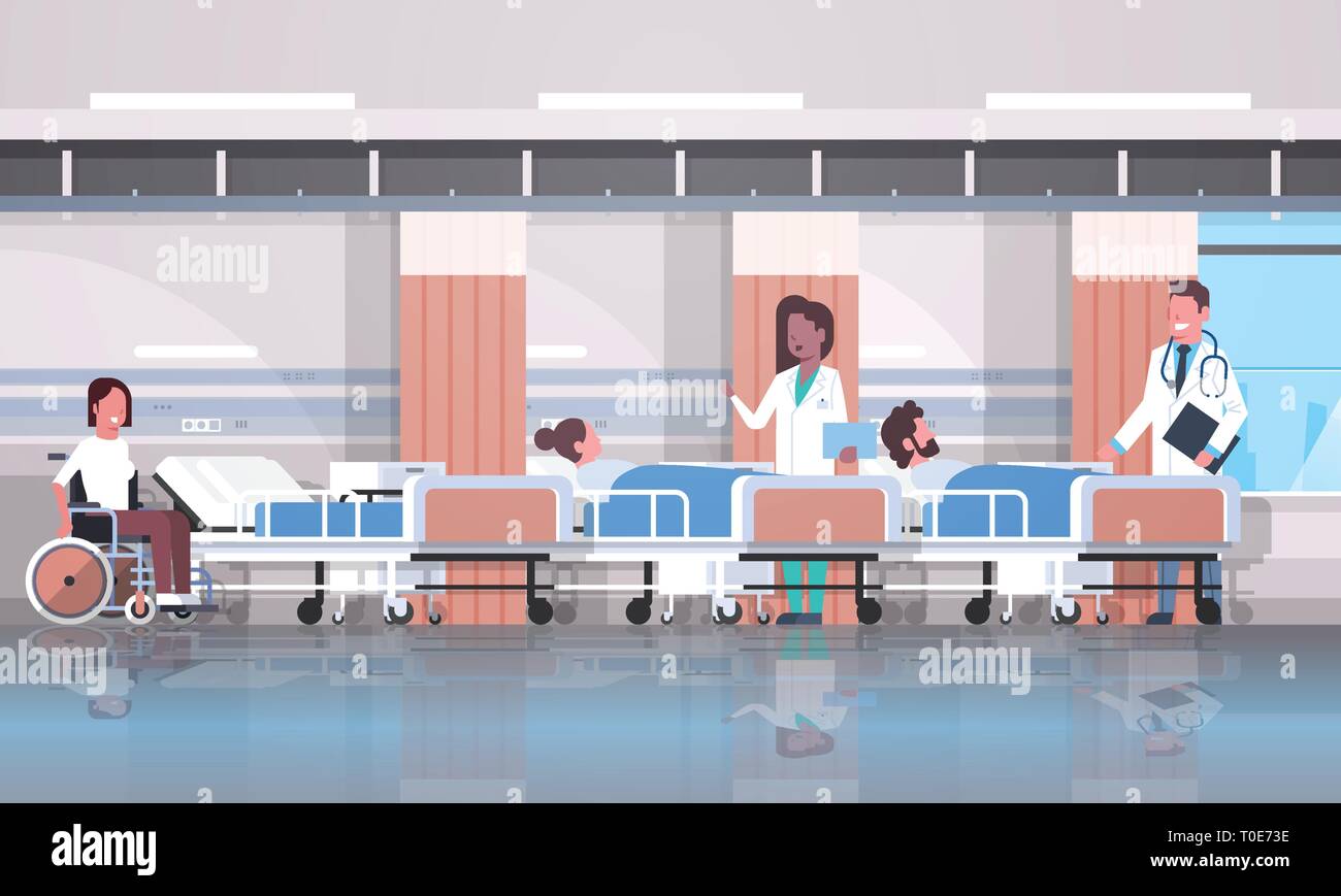 doctors team visiting disabled mix race patients sitting wheelchair ...