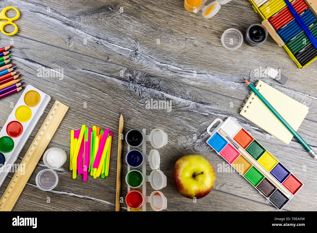 School supplies on a grey background, paints and brushes Stock Photo ...