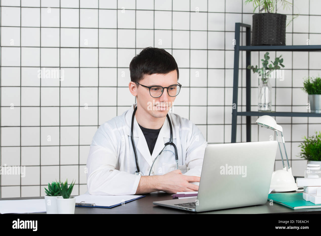 medicine, profession, technology and people concept - smiling male ...