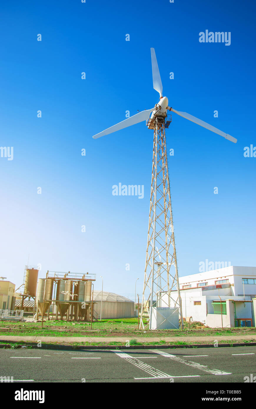Big white propeller of wind power plant on the blue sky background ...