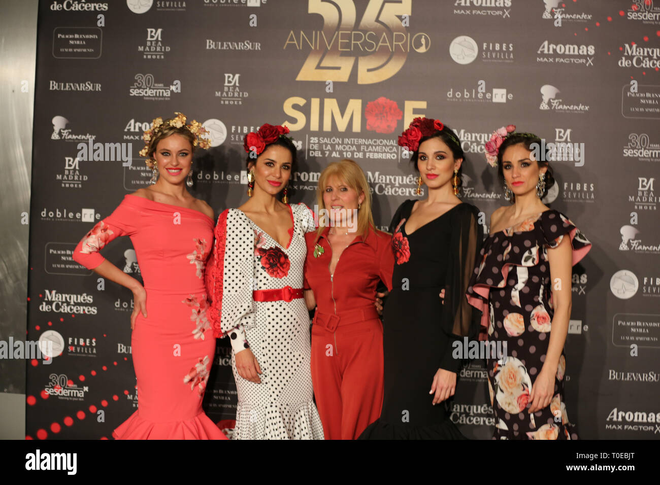 Designer Carmen Vega and models backstage after the show Stock Photo ...