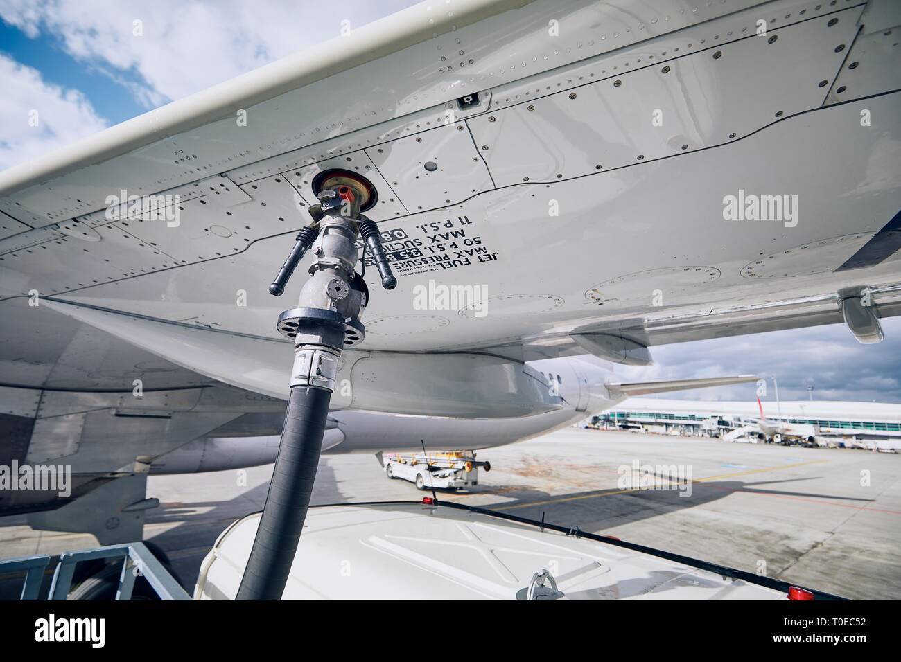 Preparations before flight. Refueling of airplane at airport. Travel ...