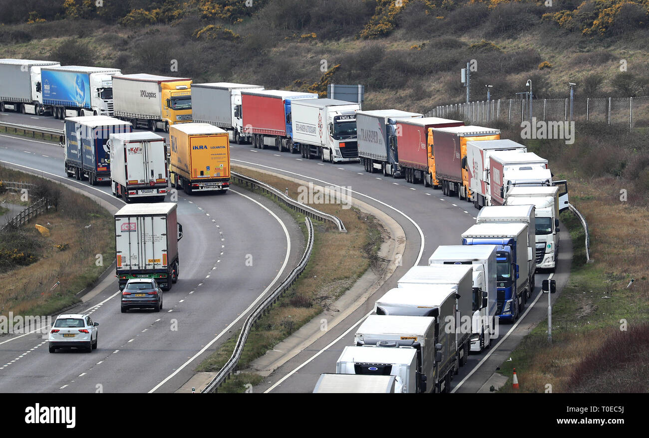 Lorries queue on the A20 to enter the Port of Dover in Kent, as French ...