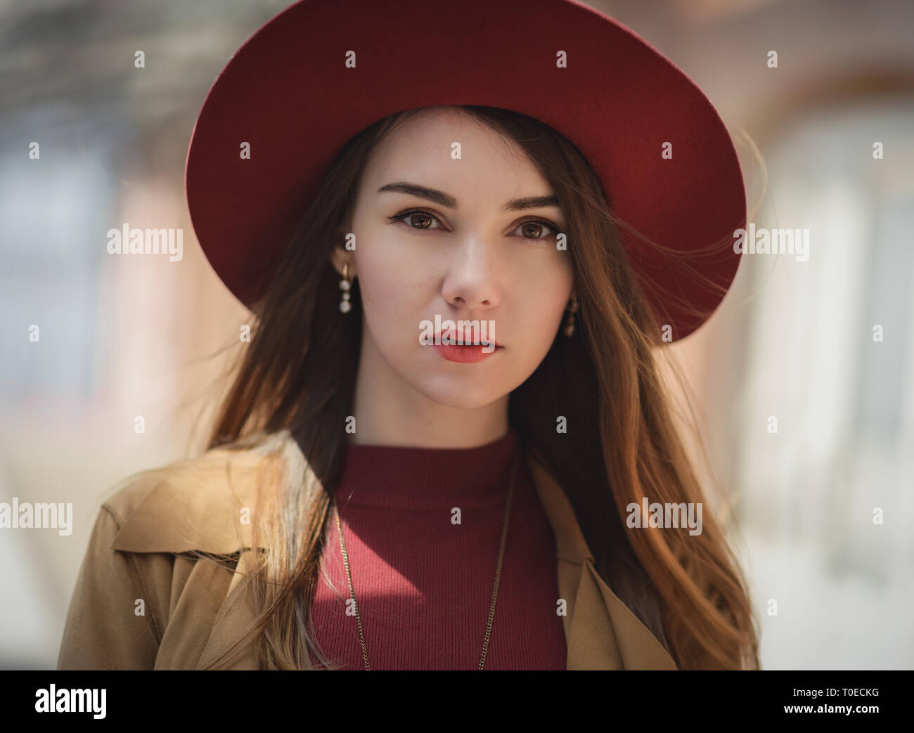 Woman in vintage cloak and red hat Stock Photo - Alamy