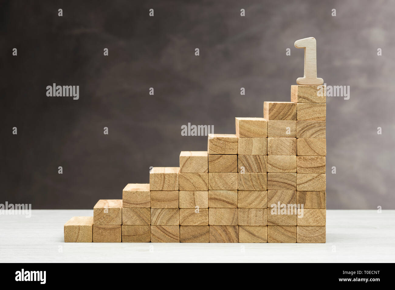 Concept of growth. Graphic with wooden steps on grey background with ...