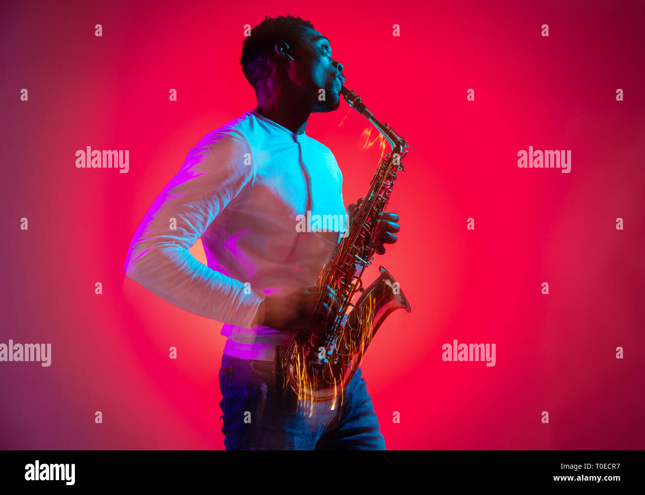 African American handsome jazz musician playing the saxophone in the ...