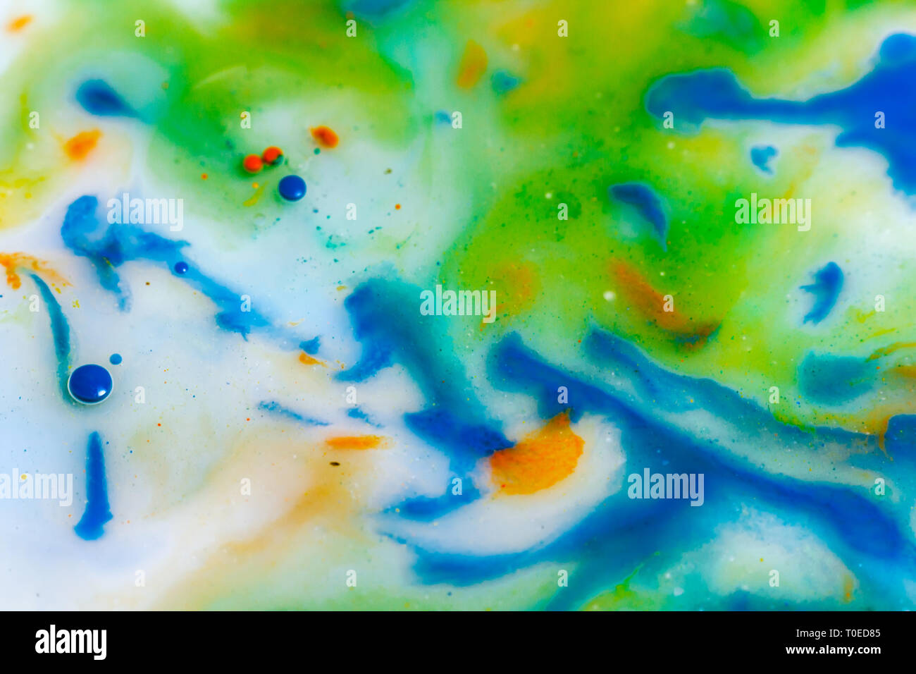 Watercolor mix in milk, color macro abstract. Water drops, oil drops ...