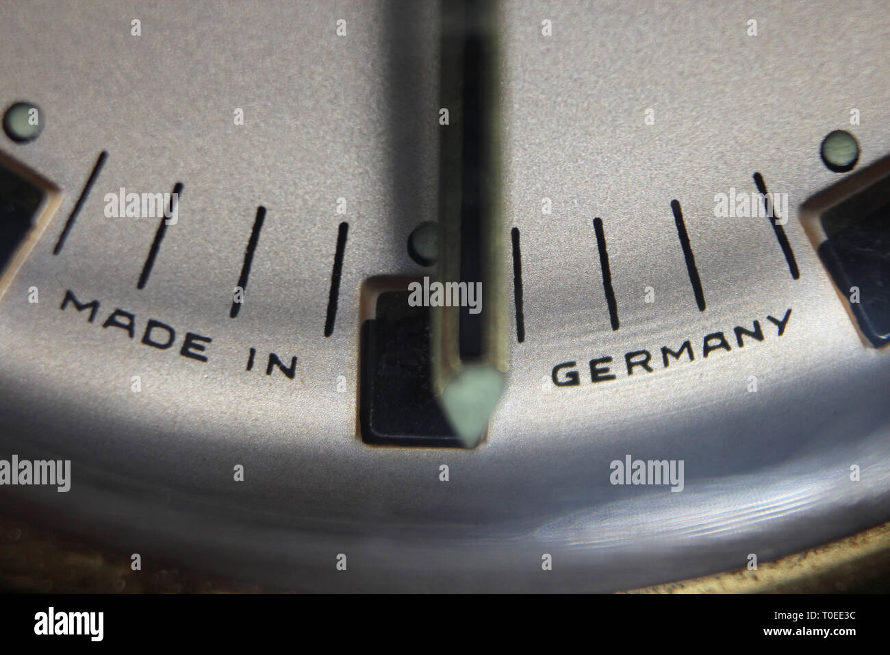 Detail of made in germany vintage alarm clock, isolated on white ...