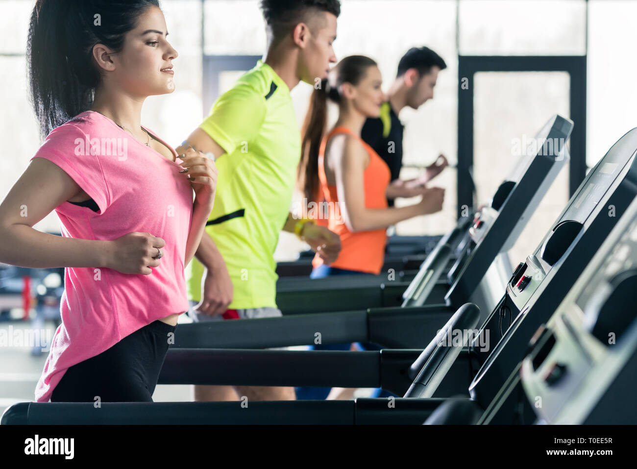 Side view of a woman on treadmill Stock Photo - Alamy