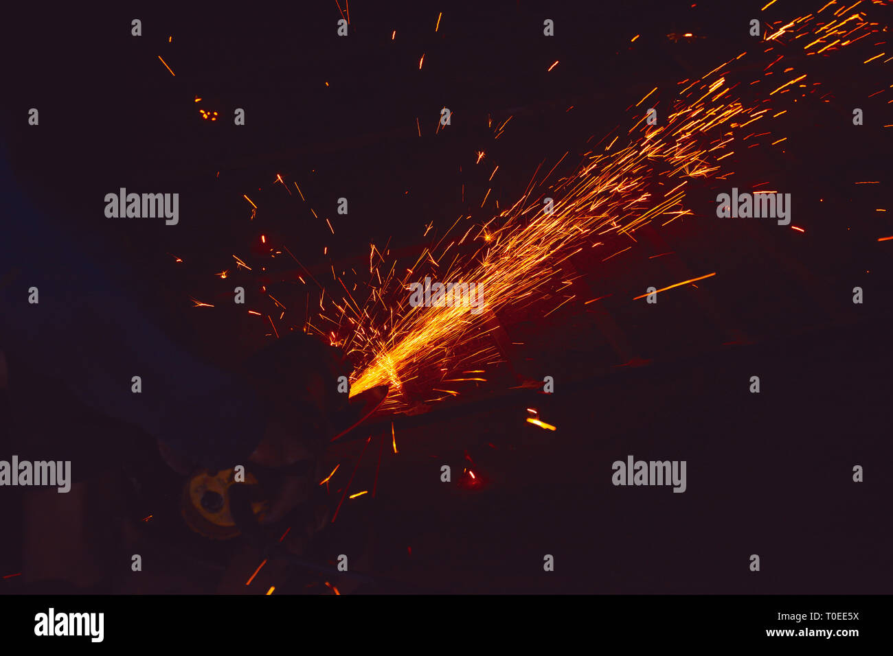Magic glowing Flow of Sparks in the Dark background Stock Photo - Alamy