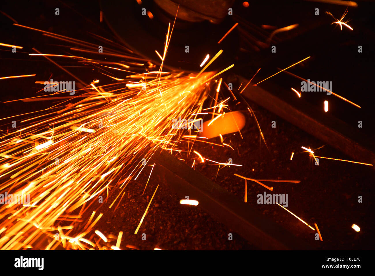 Magic glowing Flow of Sparks in the Dark background Stock Photo - Alamy