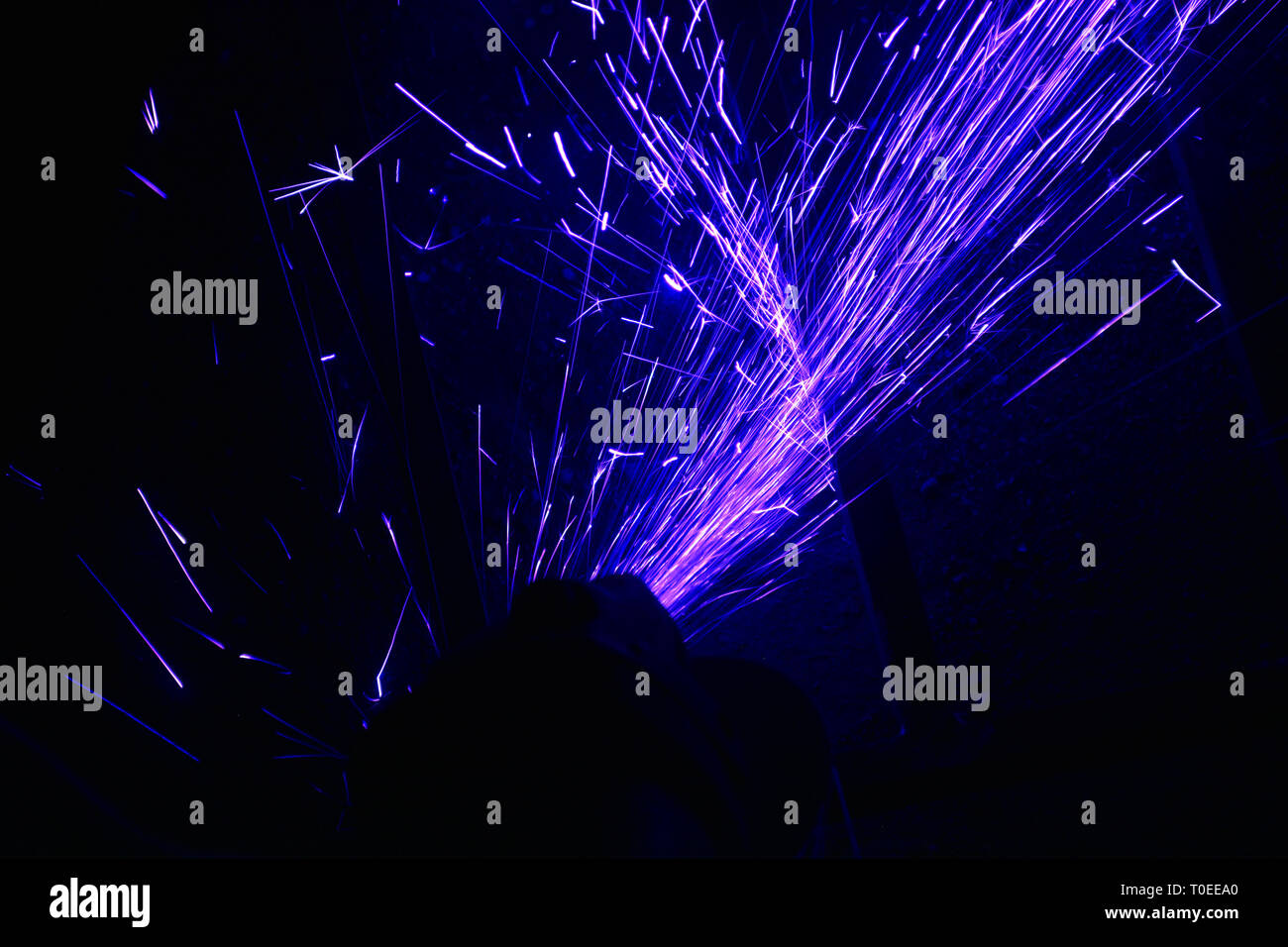 Magic glowing Flow of Sparks in the Dark background Stock Photo - Alamy