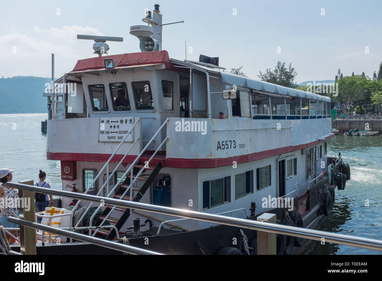 Old ferry which transports passengers between the small Hong Kong ...