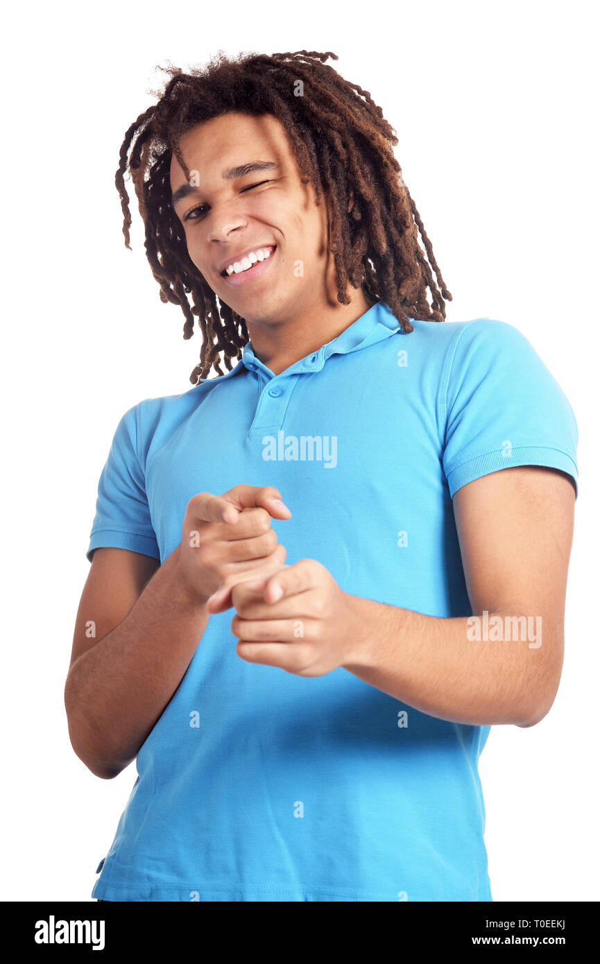 Portrait of handsome young man pointing against white background Stock ...
