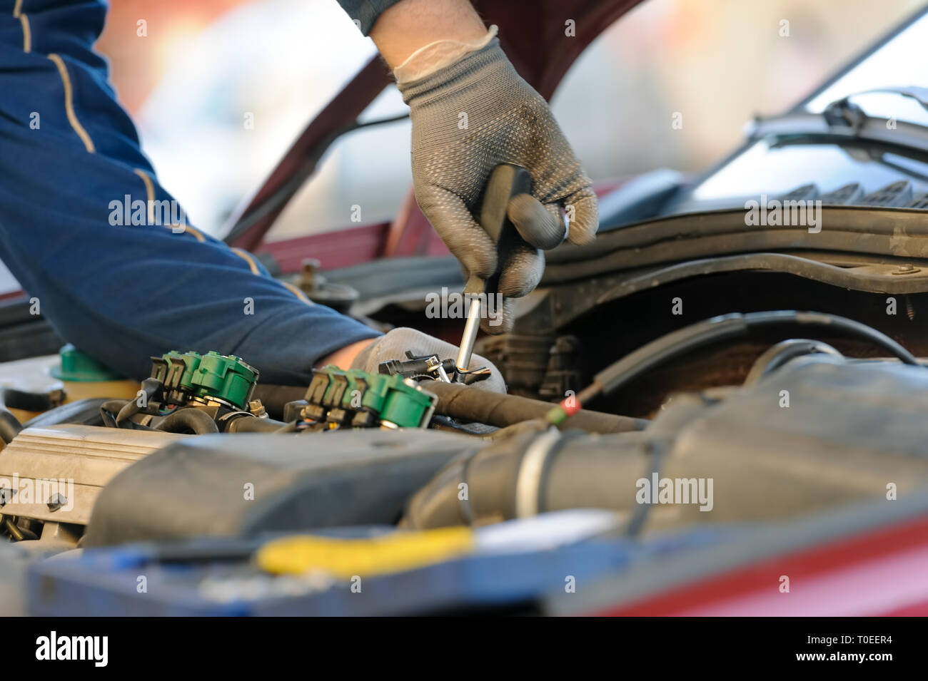 lpg car injectors in old dusty and dirty car engine is under service ...