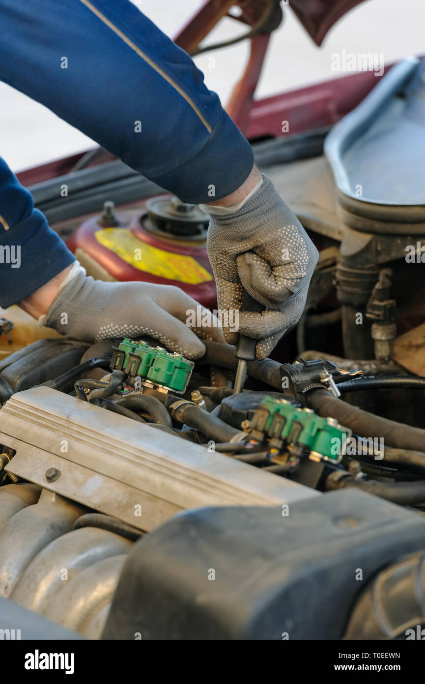 lpg car injectors in old dusty and dirty car engine is under service ...