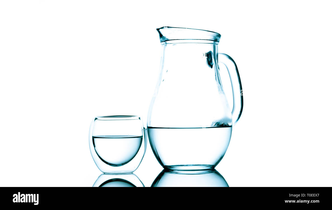 jar and glass of water on white background Stock Photo - Alamy