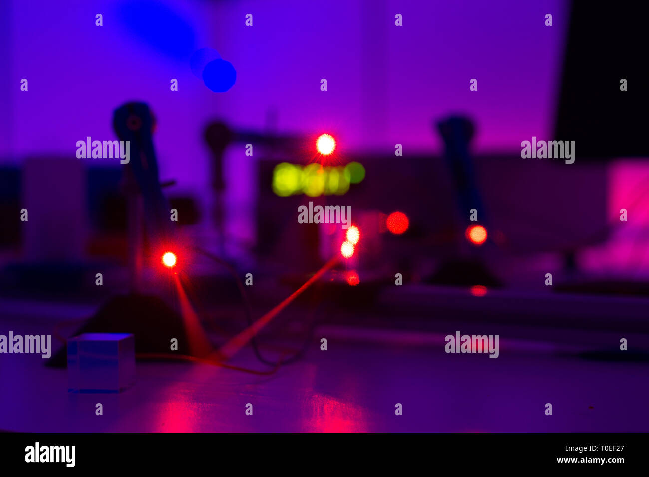 Experiment with a red laser in a physics lab Stock Photo - Alamy