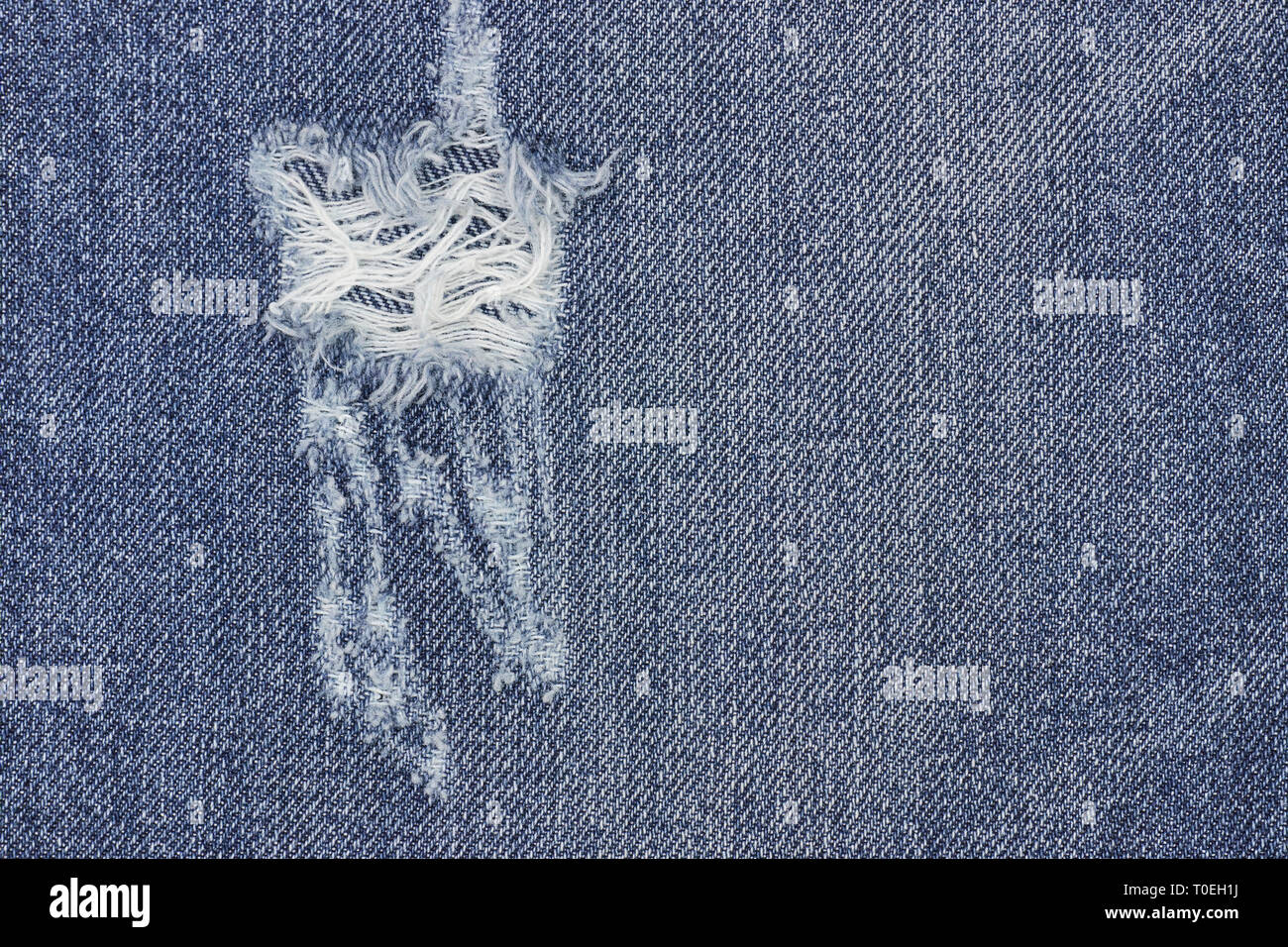 Denim ripped blue jeans texture. Abstract background faded jeans Stock ...
