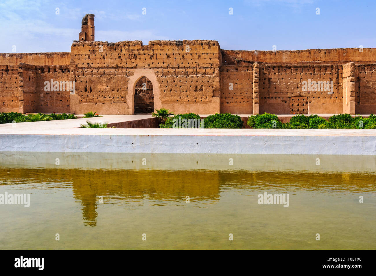 Reflection in the pool in Badi Palace in the Medina of Marrakech ...