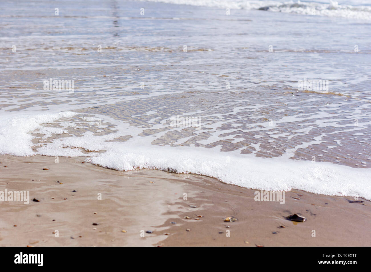Beach lapping water hi-res stock photography and images - Alamy