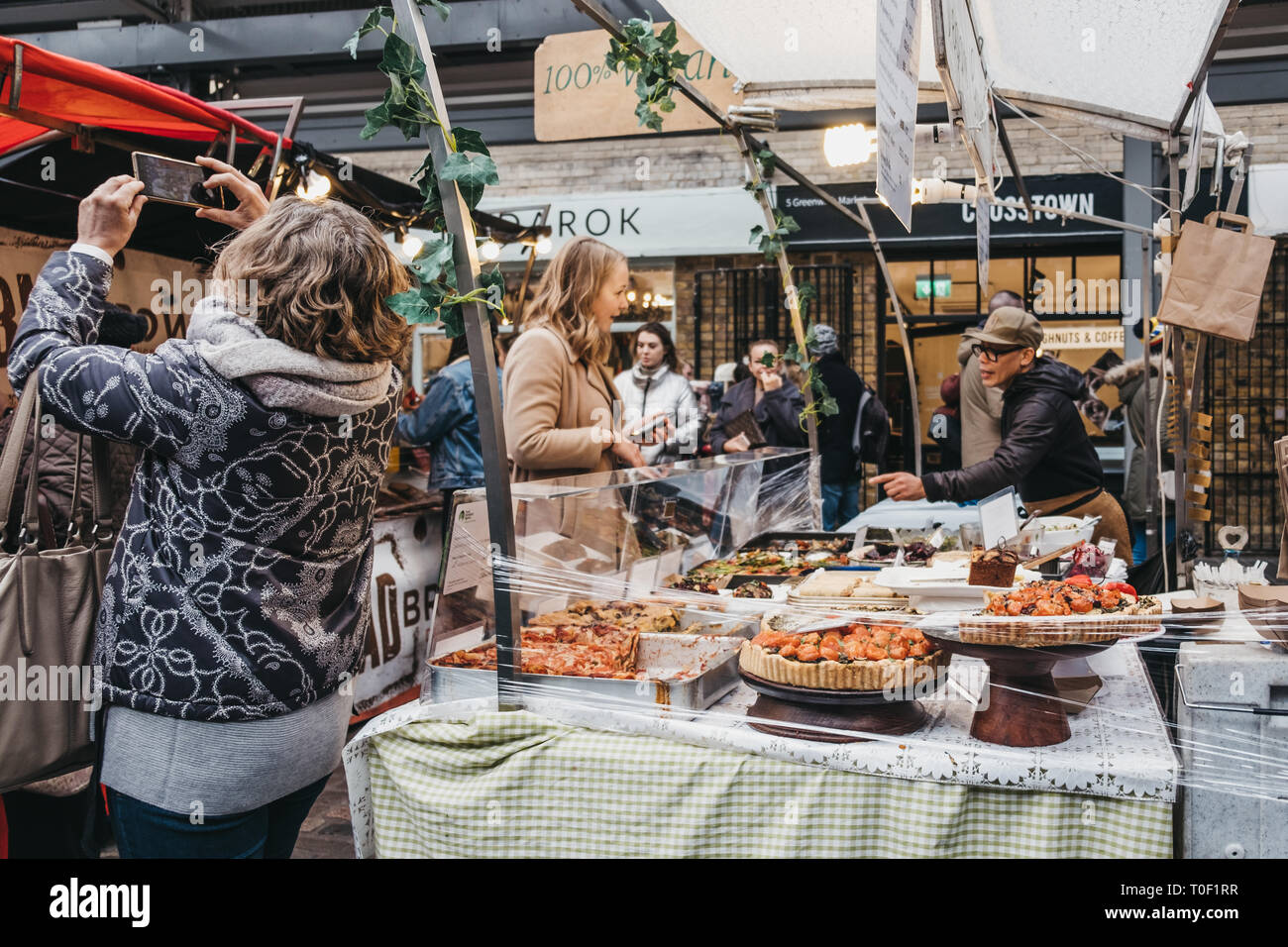 Woman standing seller market stall hi-res stock photography and images ...