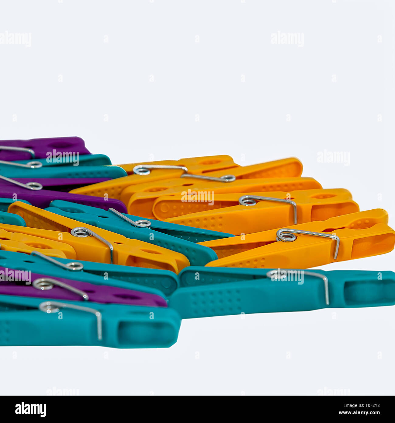 Clothes Pegs. Isolated. Colourful plastic clothes pegs on a white ...