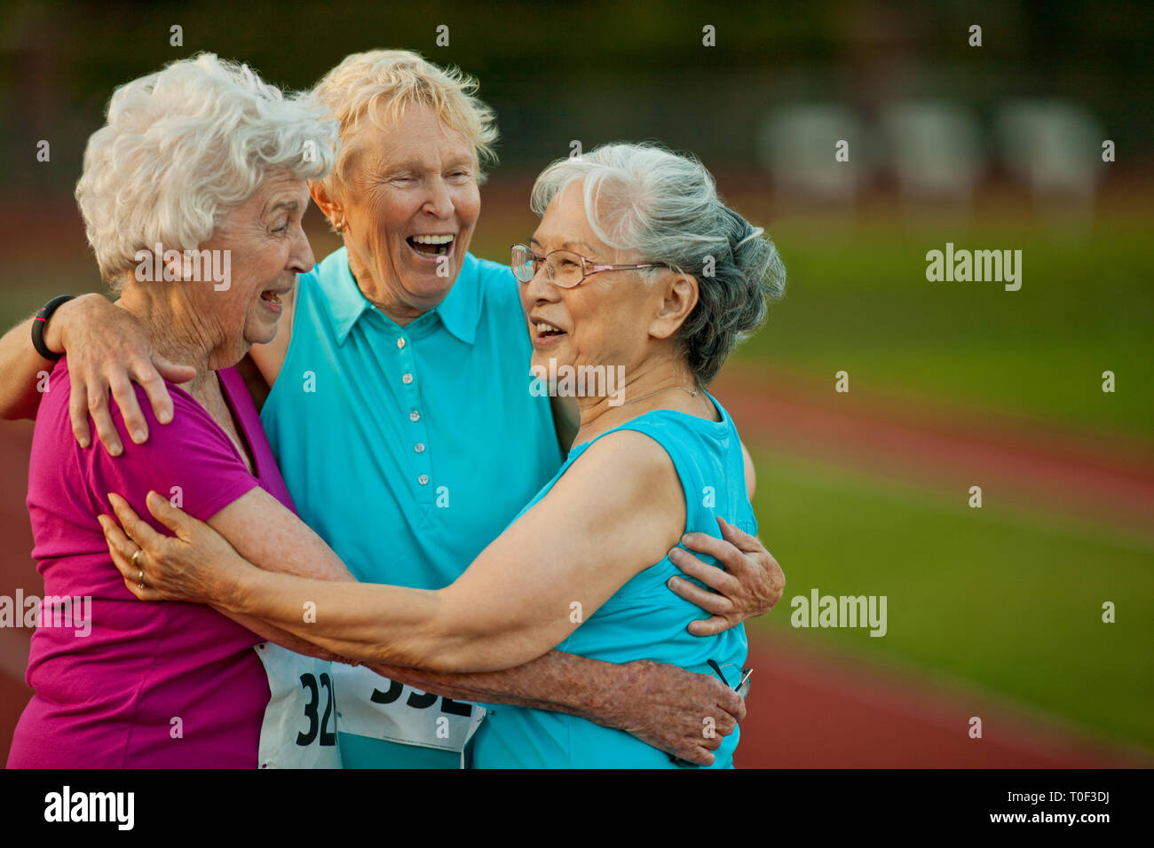 Female athletes hugging hi-res stock photography and images - Alamy