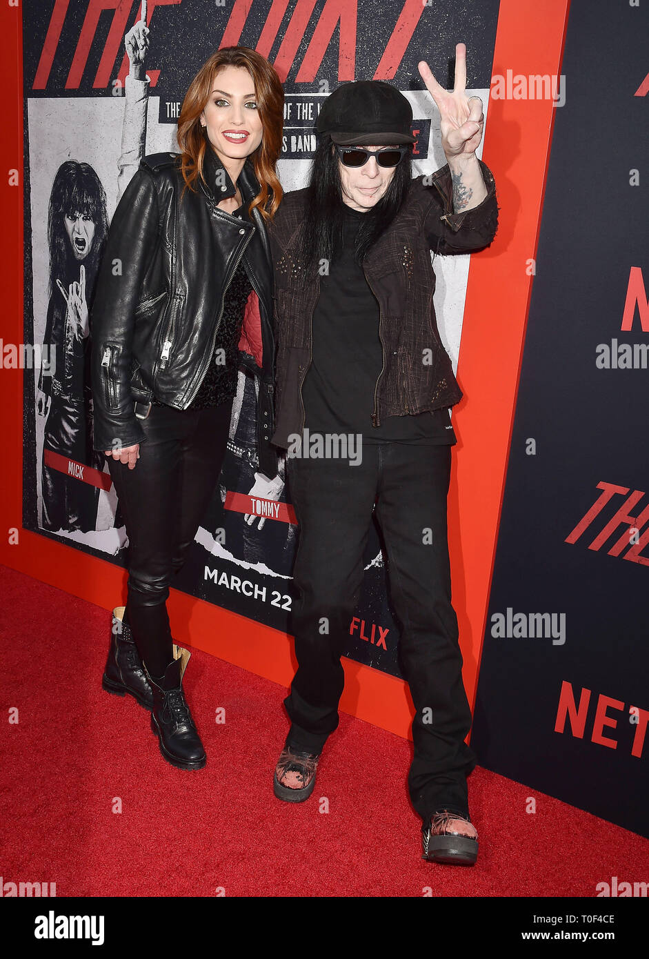 HOLLYWOOD, CA - MARCH 18: Seraina Schönenberger (L) and Mick Mars ...