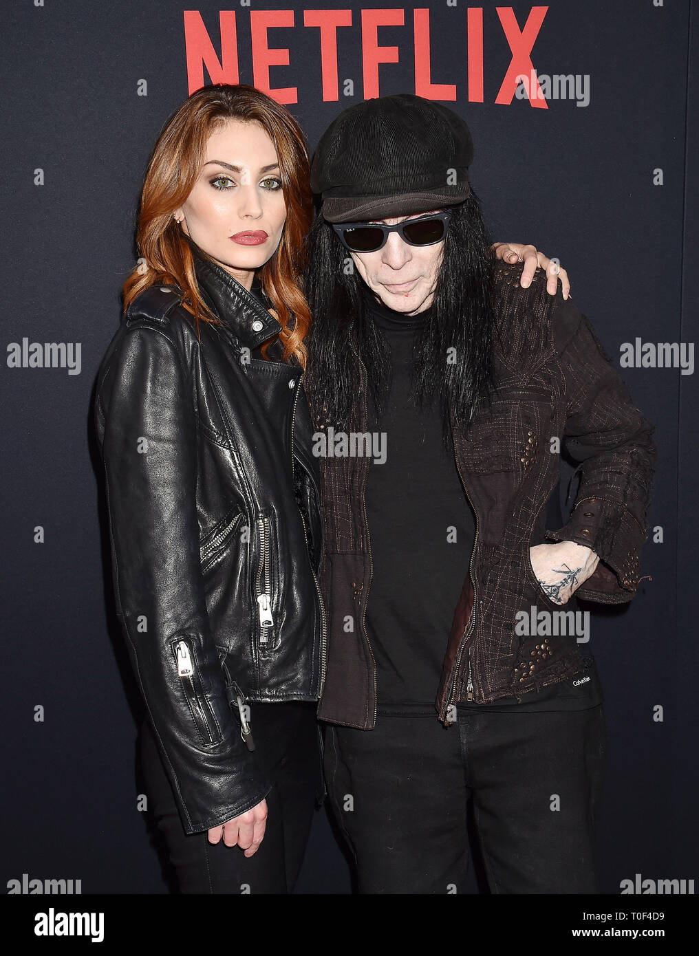 HOLLYWOOD, CA - MARCH 18: Seraina Schönenberger (L) and Mick Mars ...