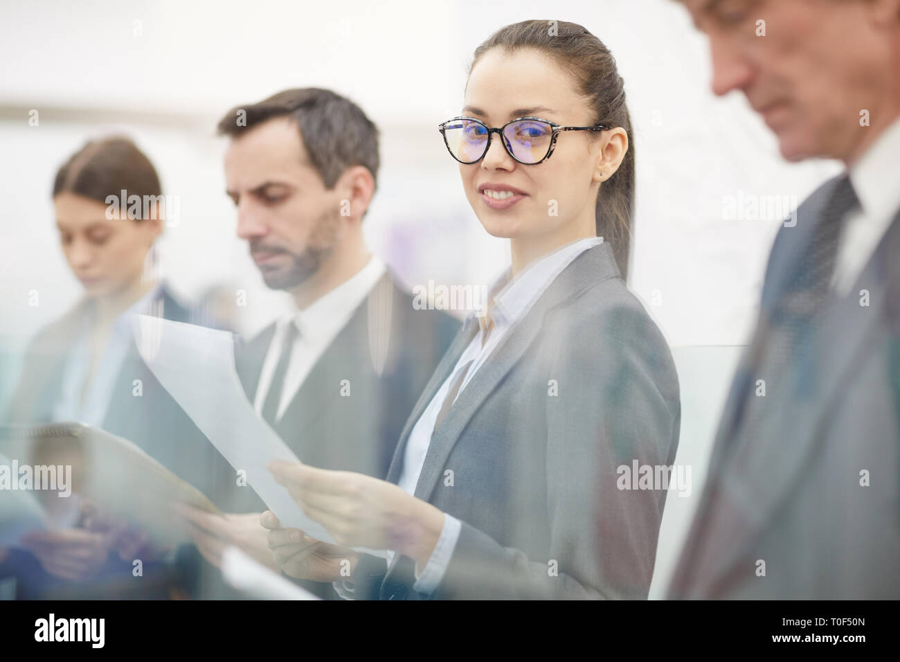 Business People Standing in Line Stock Photo - Alamy