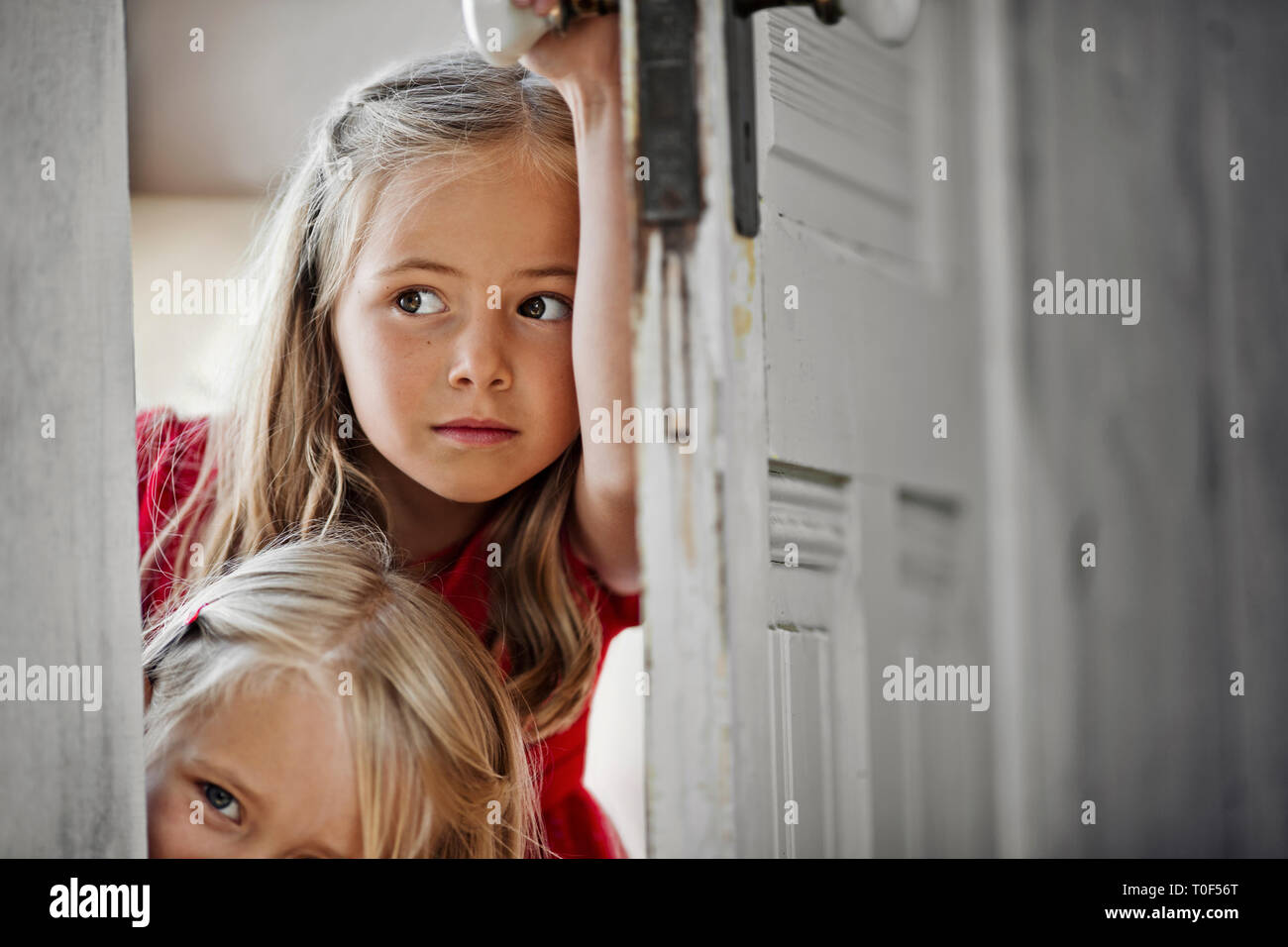 Peeking around door hi-res stock photography and images - Alamy