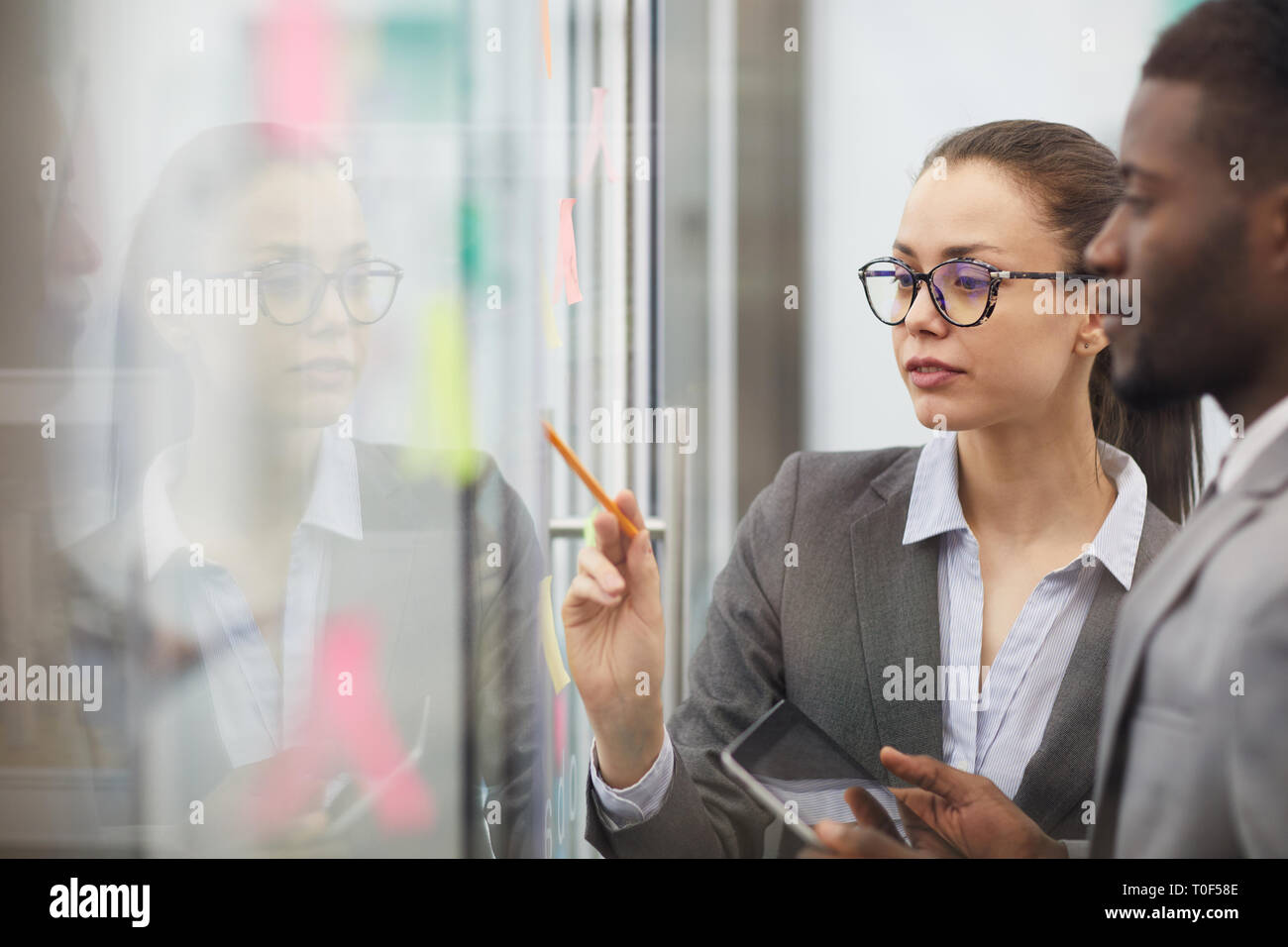 Two Colleagues Planning Project Stock Photo - Alamy