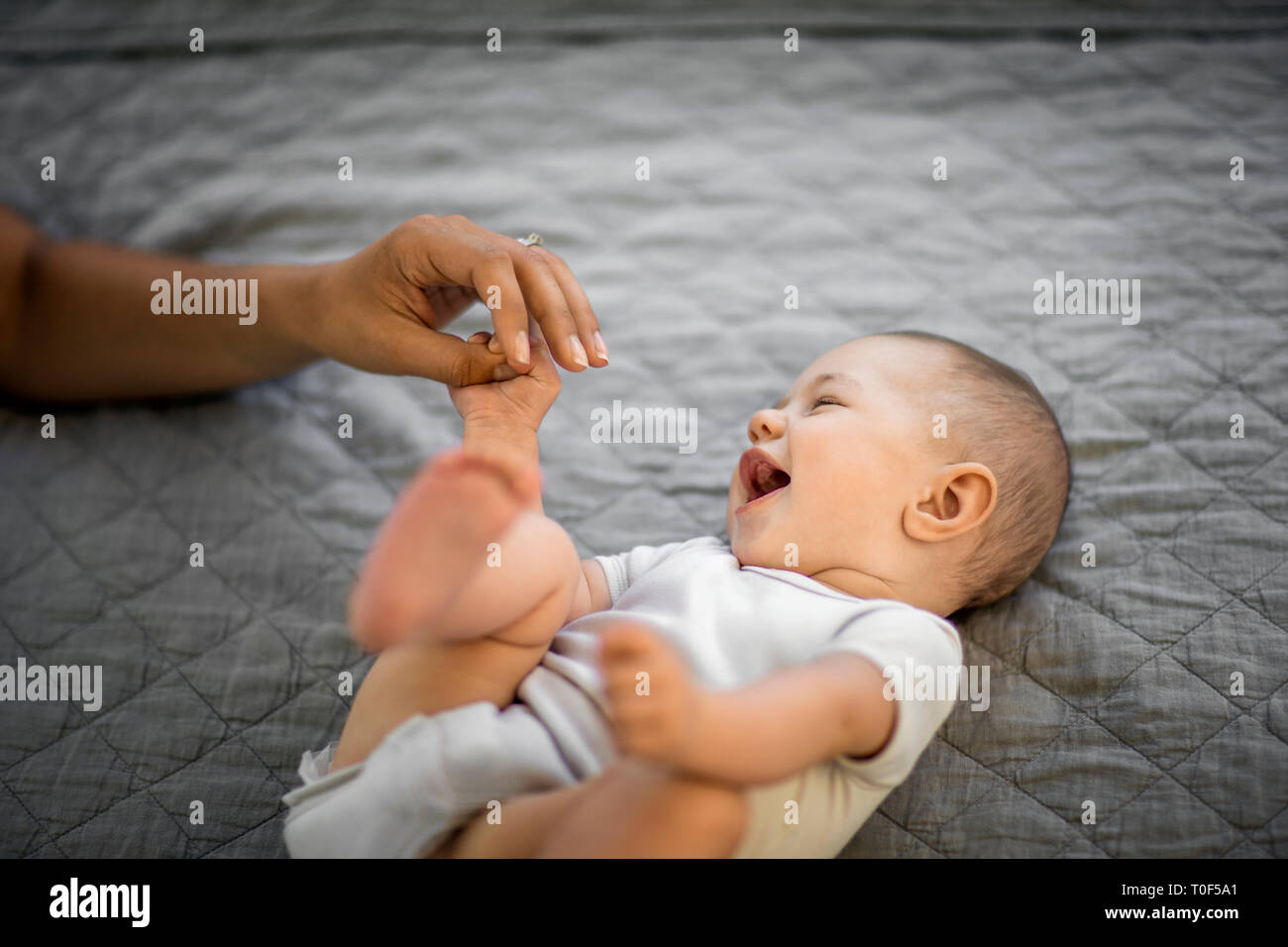 Adults and children holding hands hi-res stock photography and images ...