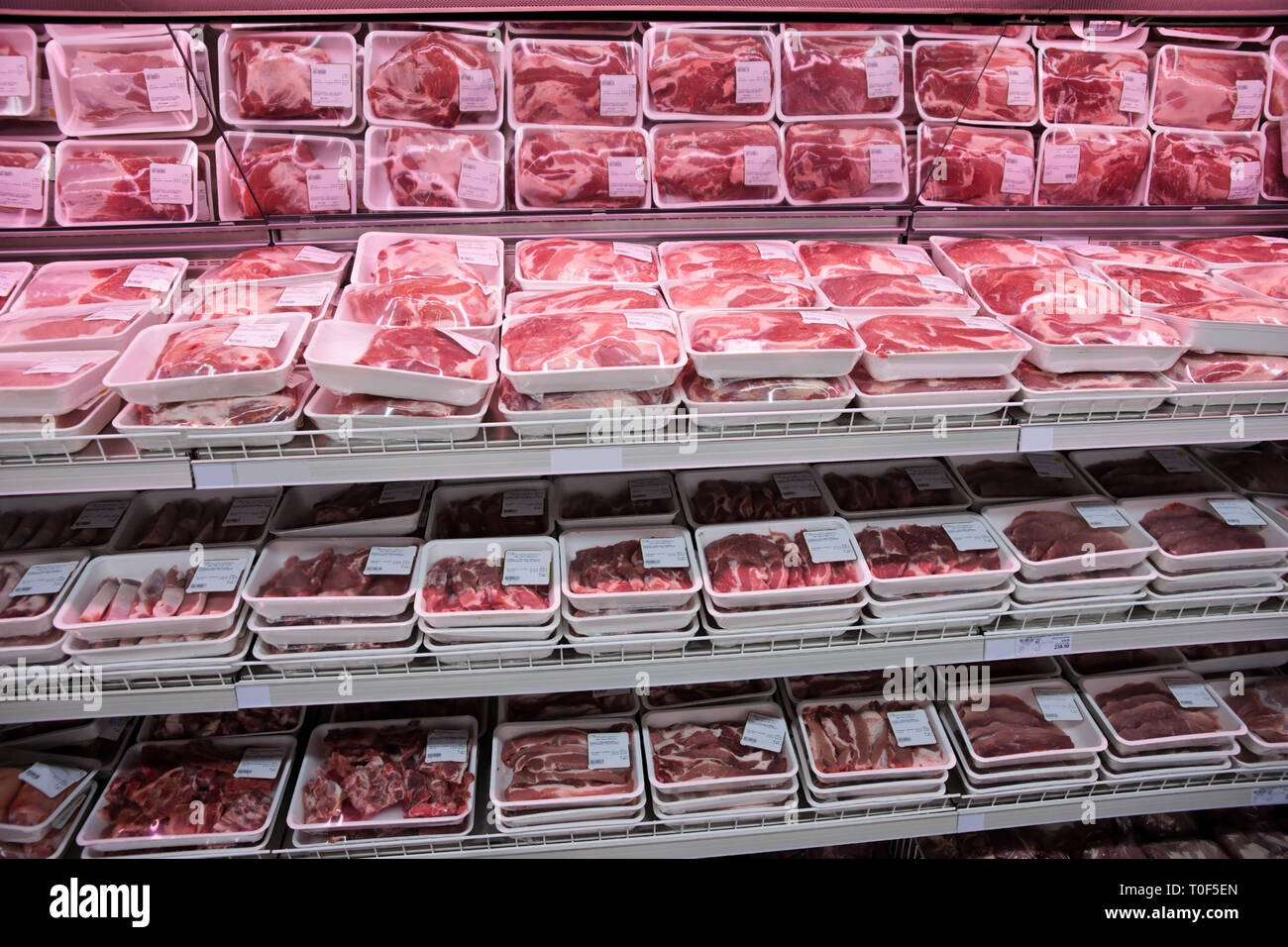 Fully loaded shelves with meat in a large supermarket Stock Photo - Alamy
